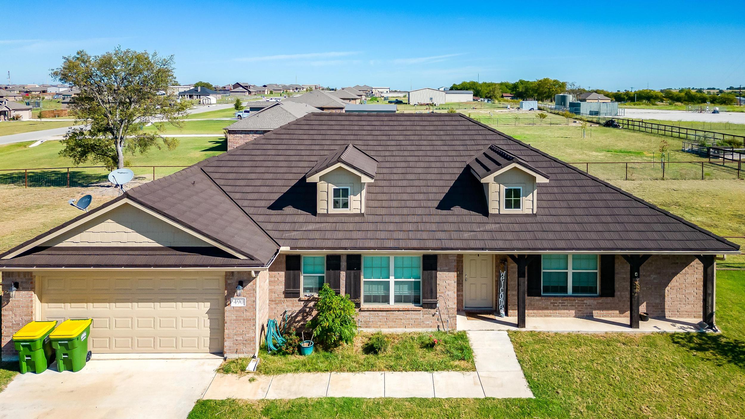 TEK Industries LLC | Worlds Best Stone Coated Steel Roofing Systems